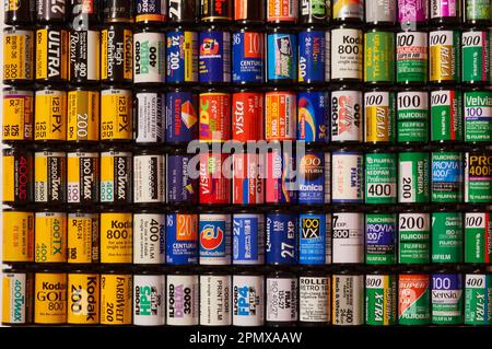 A stack of colorful old school film cartridges Stock Photo - Alamy