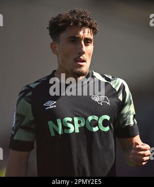 Haydon Roberts #15 of Derby County crosses the ball under pressure from ...