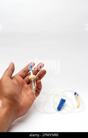 IV Infusion Set with Needle in hand Stock Photo - Alamy
