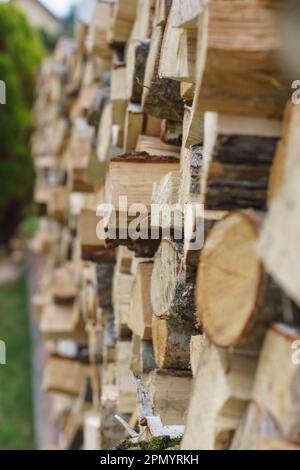 chopped wood stored by a suburban house Stock Photo - Alamy