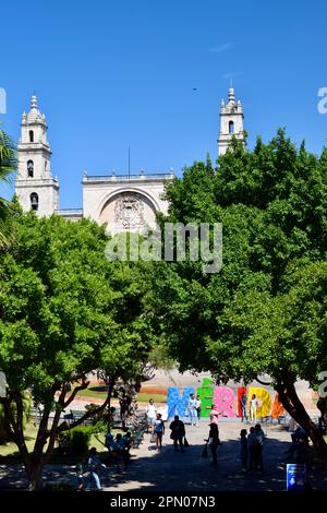 The Merida sign at Plaza Grande, with tourists in the front, as seen ...