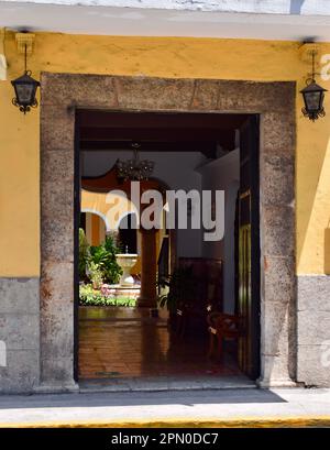 An atrium in a colonial building in the historic center of Merida ...