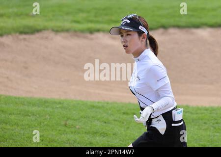 Yuna Nishimura, of Japan, in action on the 18th green during the first ...