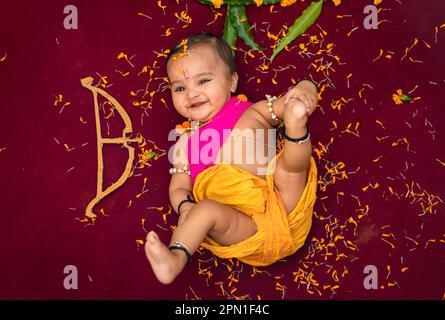 cute Indian boy dresses as lord rama with bow and flowers from top ...