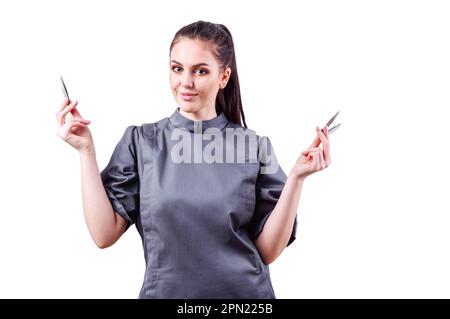 Brunette shows eyebrow tweezers in hands. Girl beautician with tool in ...