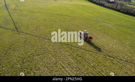 farmer driving uphill crawled tractor in the farm during spring season ...