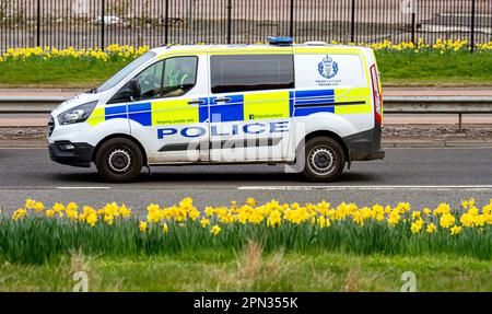 A Police Scotland police van travelling along the Kingsway West Dual ...