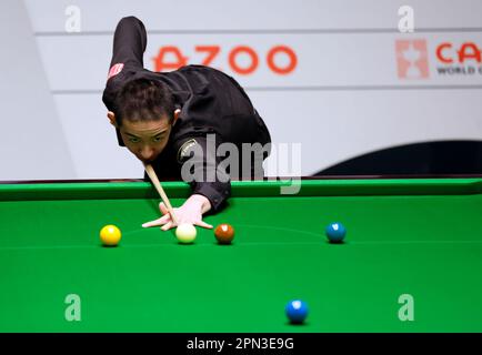 Wu Yize at the table during day two of the Cazoo World Snooker ...