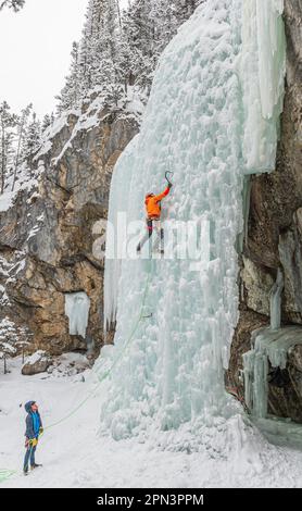 Rowan Lovell and Brandon Prince climbing in Johnston Canyon Stock Photo ...