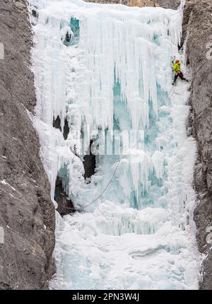 Elijah Weber climbing a route called Wicked Wanda WI4+ in Canada Stock ...