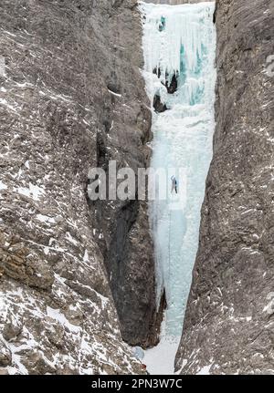 Rowan Lovell climbing a route called Wicked Wanda WI4+ in Canada Stock ...