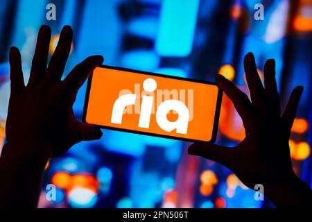 In this photo illustration, the Ria Money Transfer logo is displayed on ...