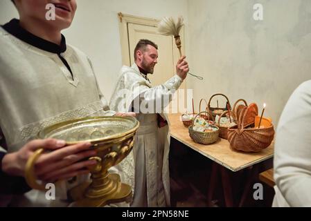 The Orthodox priest Igor Tatarintsev, officiates the holy office of the ...