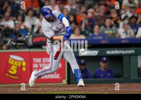 Texas Rangers' Robbie Grossman hits a single during the eighth inning ...