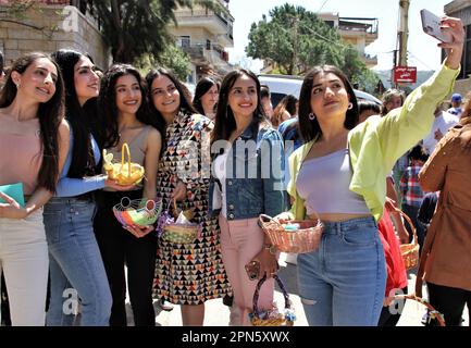 Hasbaya, Lebanon. 16th Apr, 2023. Two girls play egg tapping during the ...