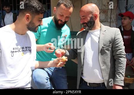 Hasbaya, Lebanon. 16th Apr, 2023. Two girls play egg tapping during the ...