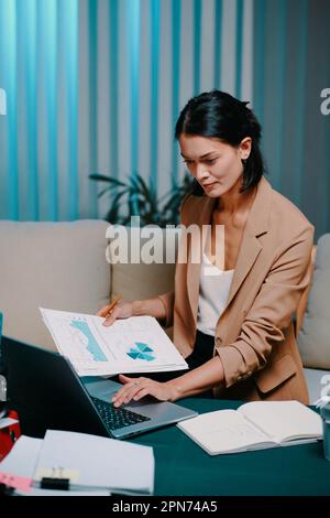 Young financial manager working late at night in office Stock Photo - Alamy