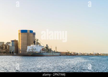 Commercial cement carrier at Port Adelaide docks viewed across the Port ...