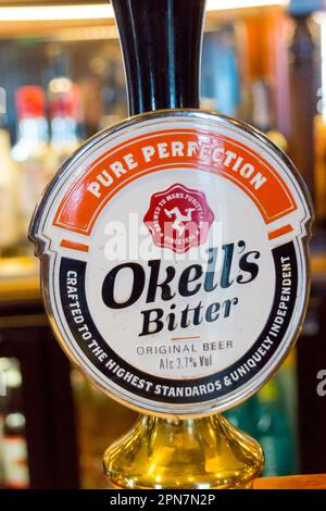 Okell's brewery pump clips on the bar of the Terminus Tavern ...