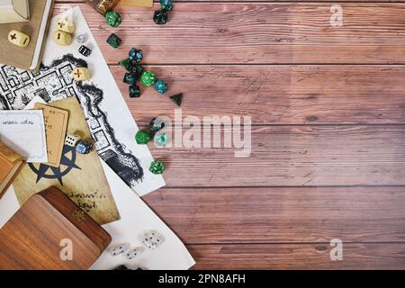 Tabletop role playing flat lay background with colorful RPG dices, rule ...