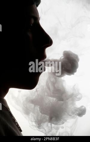 Profile Silhouette of a Man Smoking on White Background Stock Photo - Alamy