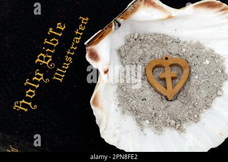 Bible and scalllop shell with ashes. Ash Wednesday. Lent season. France ...
