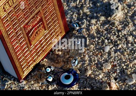 The cover of the Holy Quran (Koran) with the 99 names of Allah in ...