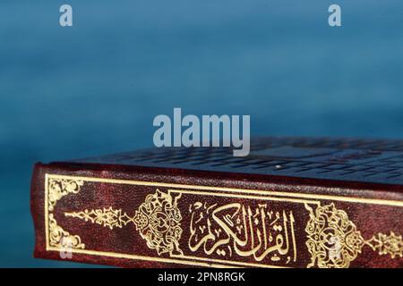 The cover of the Holy Quran (Koran) with the 99 names of Allah in ...
