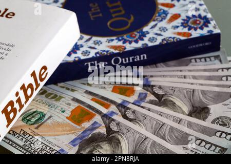 Money, religion and interfaith. Banknotes of US dollars with wooden ...