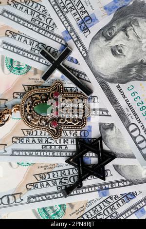 Money, religion and interfaith. Banknotes of US dollars with wooden ...