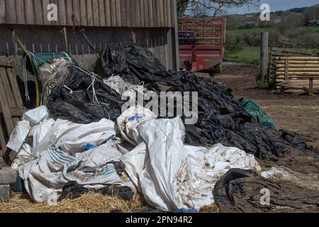 Silage wrapping plastic rubbish waste in a field on farmland on a farm ...