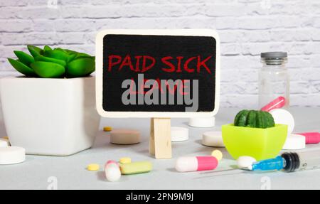 medical mask with the inscription paid sick leave Stock Photo - Alamy