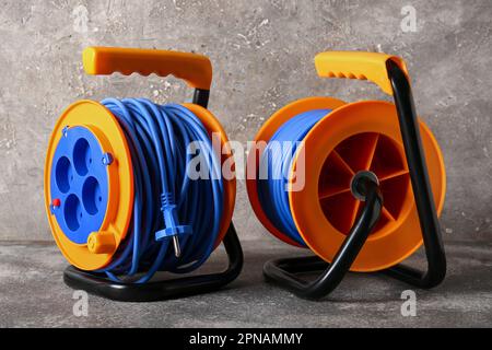 Extension electric cable reels on white background Stock Photo - Alamy