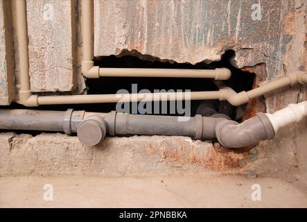 Transfer of water pipes and sewerage drain in the wall. Bathroom ...