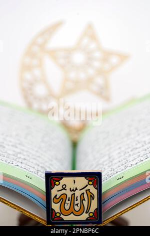 Open holy Quran ( Kuran ) and Crescent and Star, symbols of Islamic ...