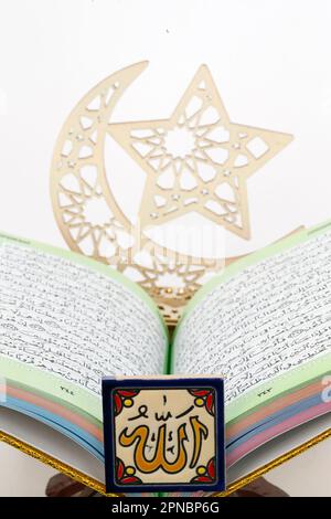 Open holy Quran ( Kuran ) and Crescent and Star, symbols of Islamic ...