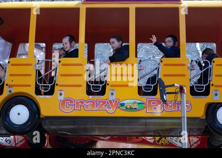 During Passover when it's mandated to have fun, Hasidic children ride ...