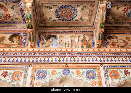 Colorful paintings on the entrance gate of Raghu Nath Ji Mandir ...