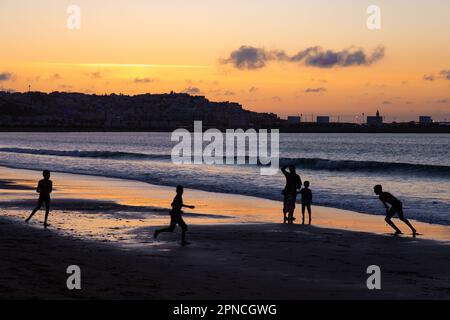 Tangier, Morocco 2022: kids silhouette in a scenic sunset in the ...