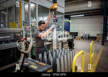 This photograph shows a 155 shell for Cesar gun being manufactured ...
