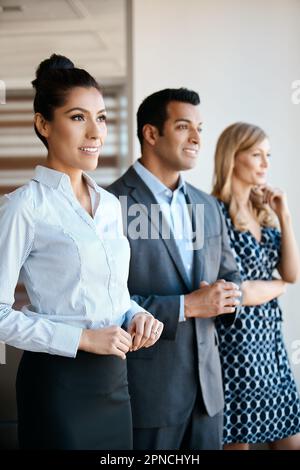 Threes company. three businesspeople working together in the office ...