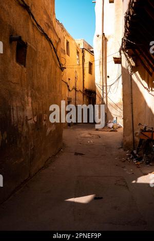 A very narrow alley in downtown with arabic inscriptions, Lahore ...