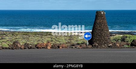 Traffic Signs On A Stone Pillar, Lanzarote, Canary Islands, Spain Stock ...