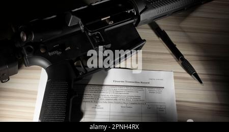 AR-15 and background check form for its purchase with pen Stock Photo ...