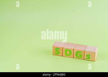SDGs - sustainable development goals word concept on cubes Stock Photo ...