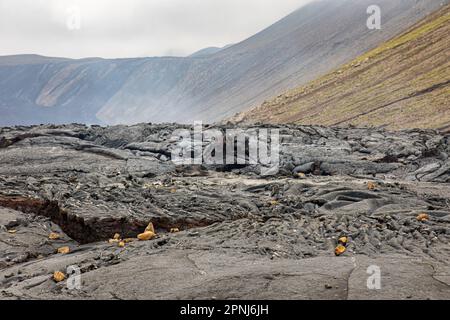 Black solidified lava of Fagradalsfjall volcano in a foggy day Stock ...