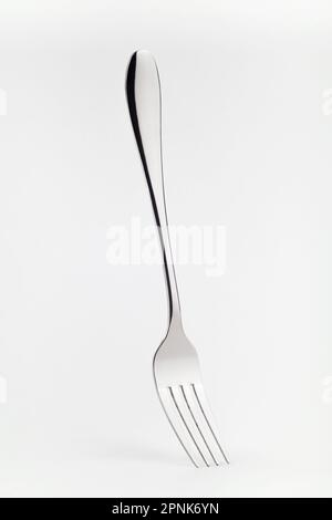 Stainless steel fork isolated on white background Stock Photo - Alamy