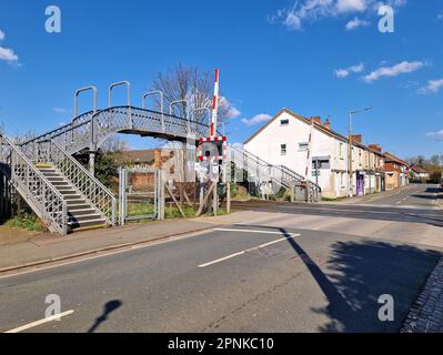 Old wrought iron footbridge over a railway crossing in Long Eaton ...