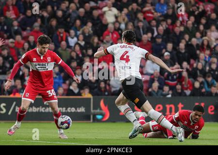 Hayden Hackney of Middlesbrough goes in for the ball with Lewis Brunt ...