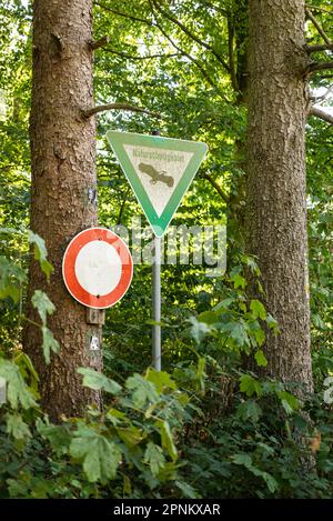 “Naturschutzgebiet” sign on the edge of a forest, marking a nature ...